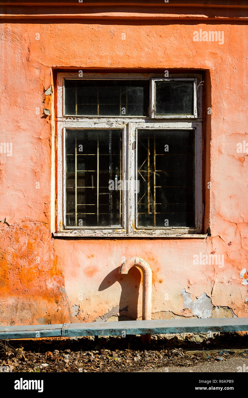 Old orange wall with a window. Abandoned building Stock Photo - Alamy