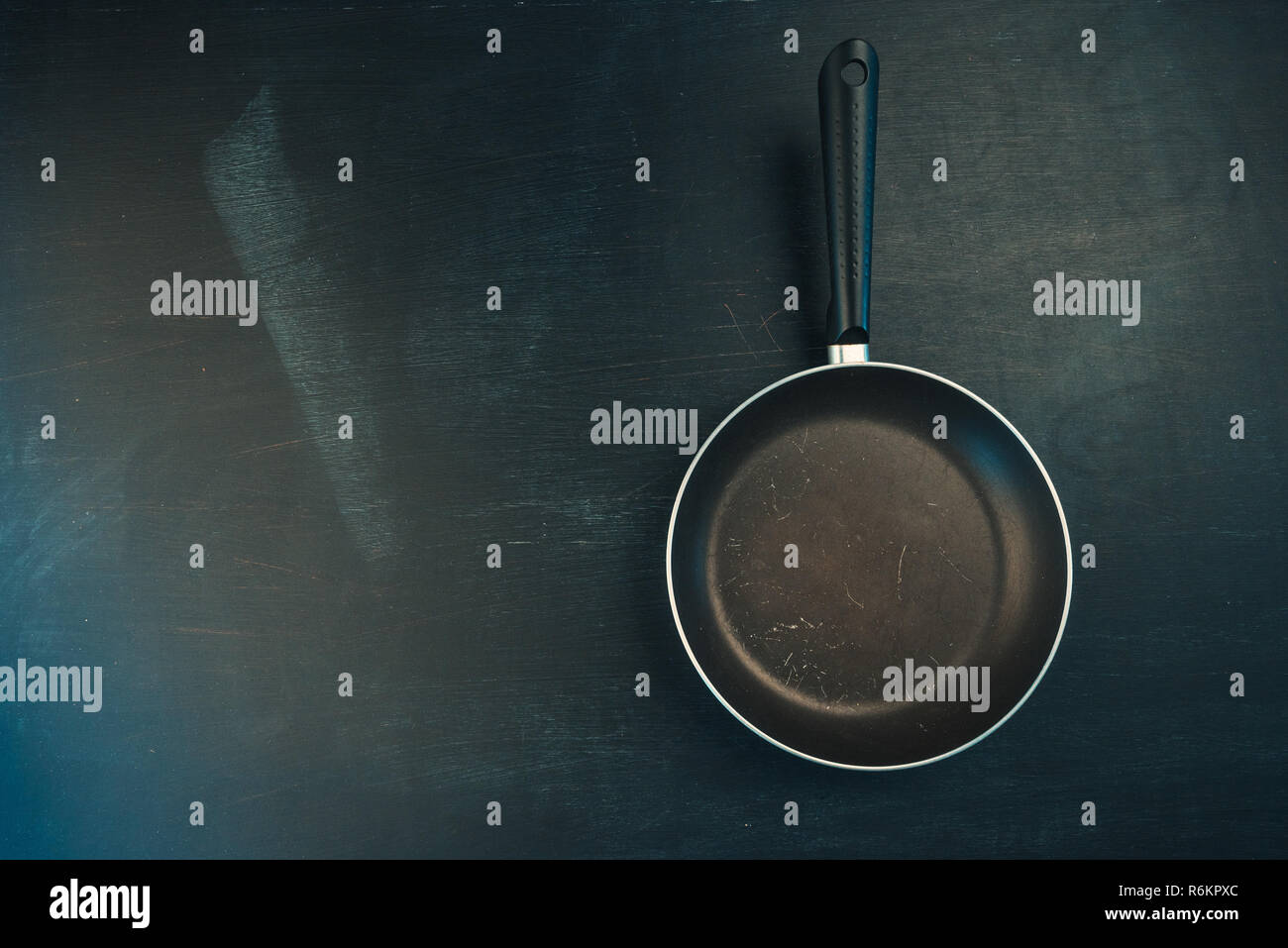 Used old empty frying pan skillet top view on dark background Stock ...