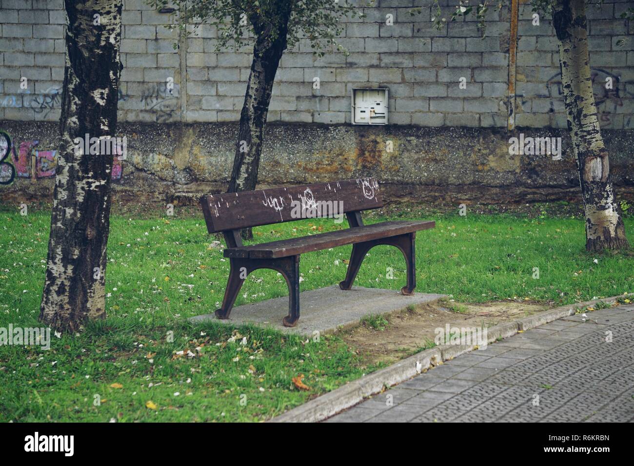 the old wooden bench in the street Stock Photo - Alamy