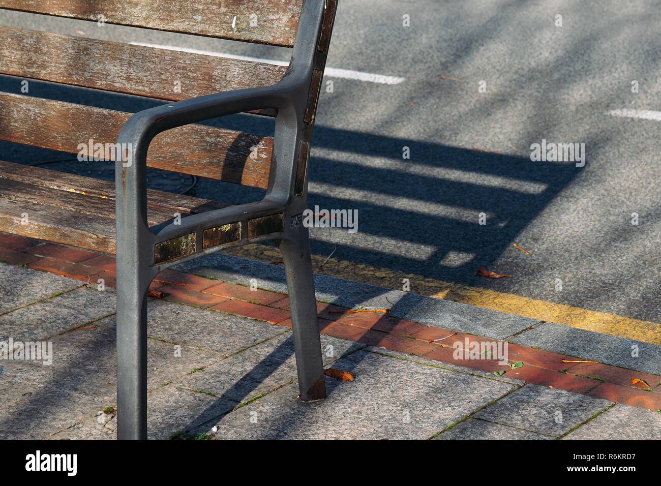 the old wooden bench in the street Stock Photo - Alamy