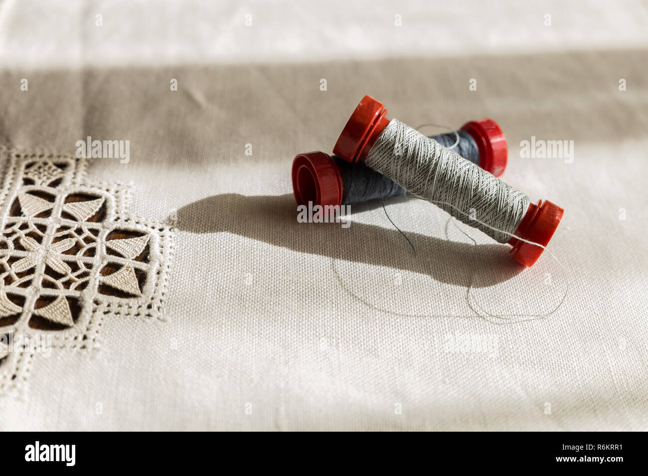 two spools of gray thread Stock Photo - Alamy