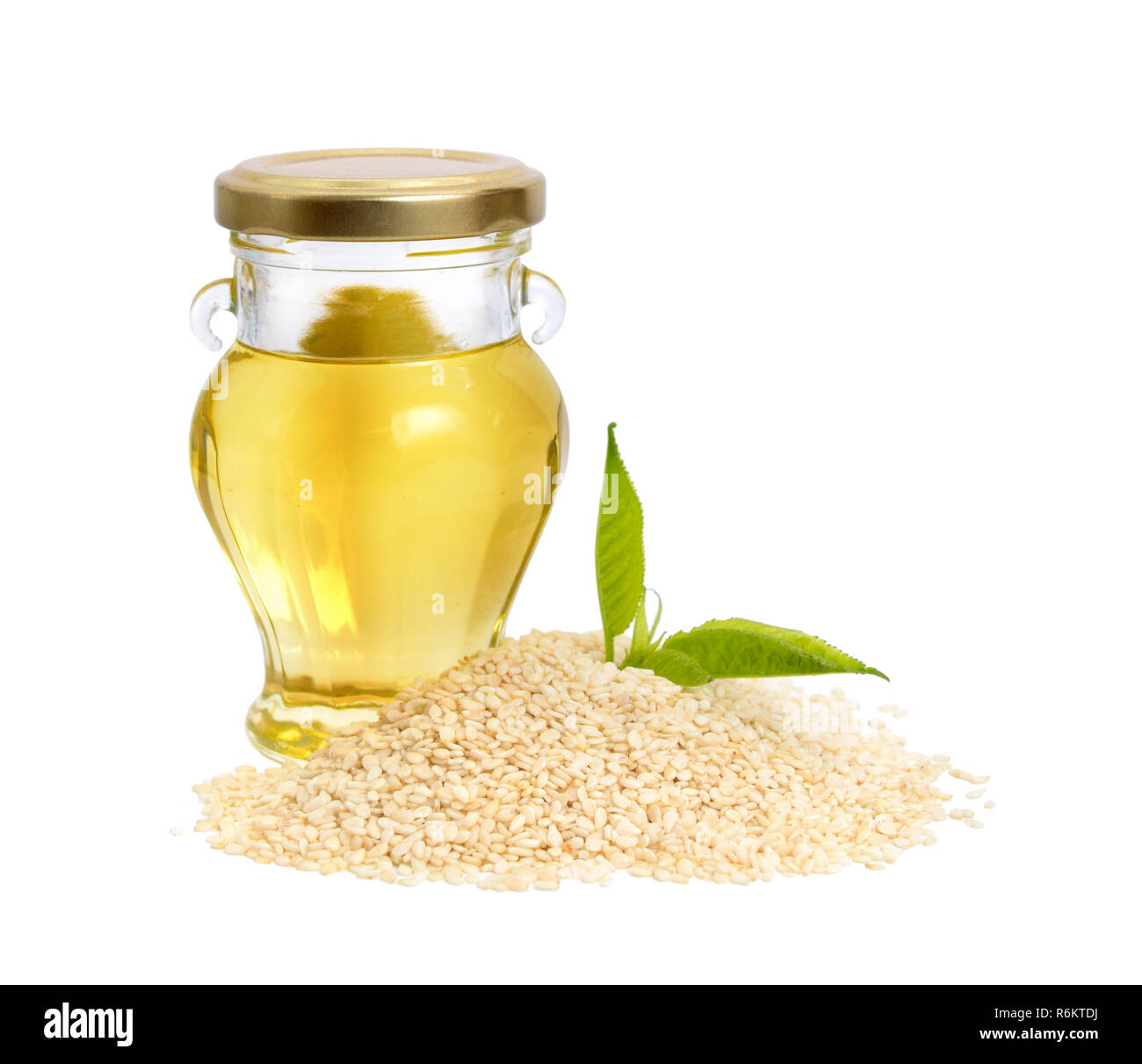 Sesame oil with seeds. Isolated on white background Stock Photo - Alamy
