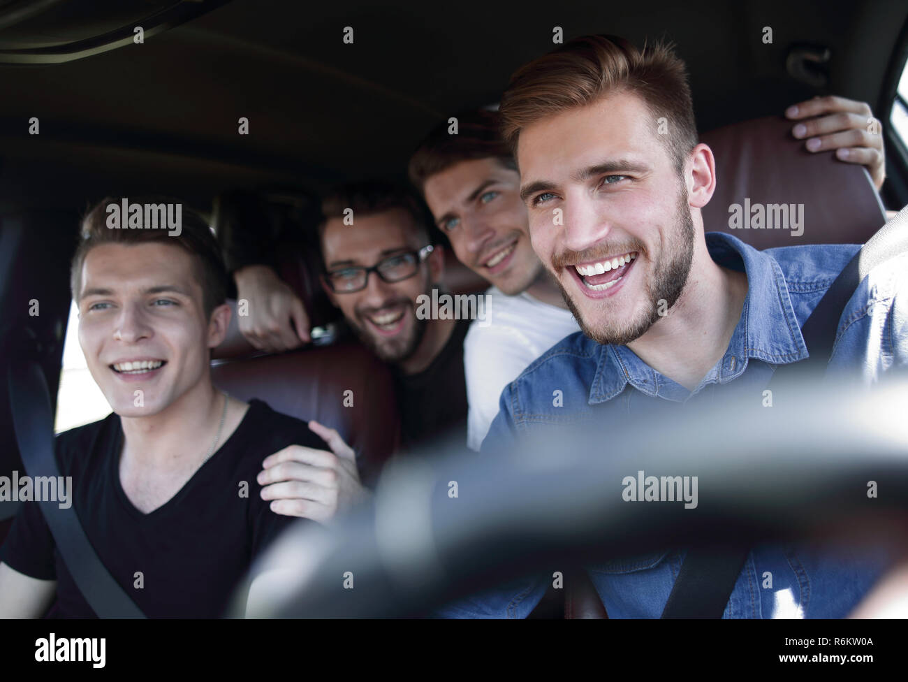 Group of happy friends on a car Stock Photo - Alamy