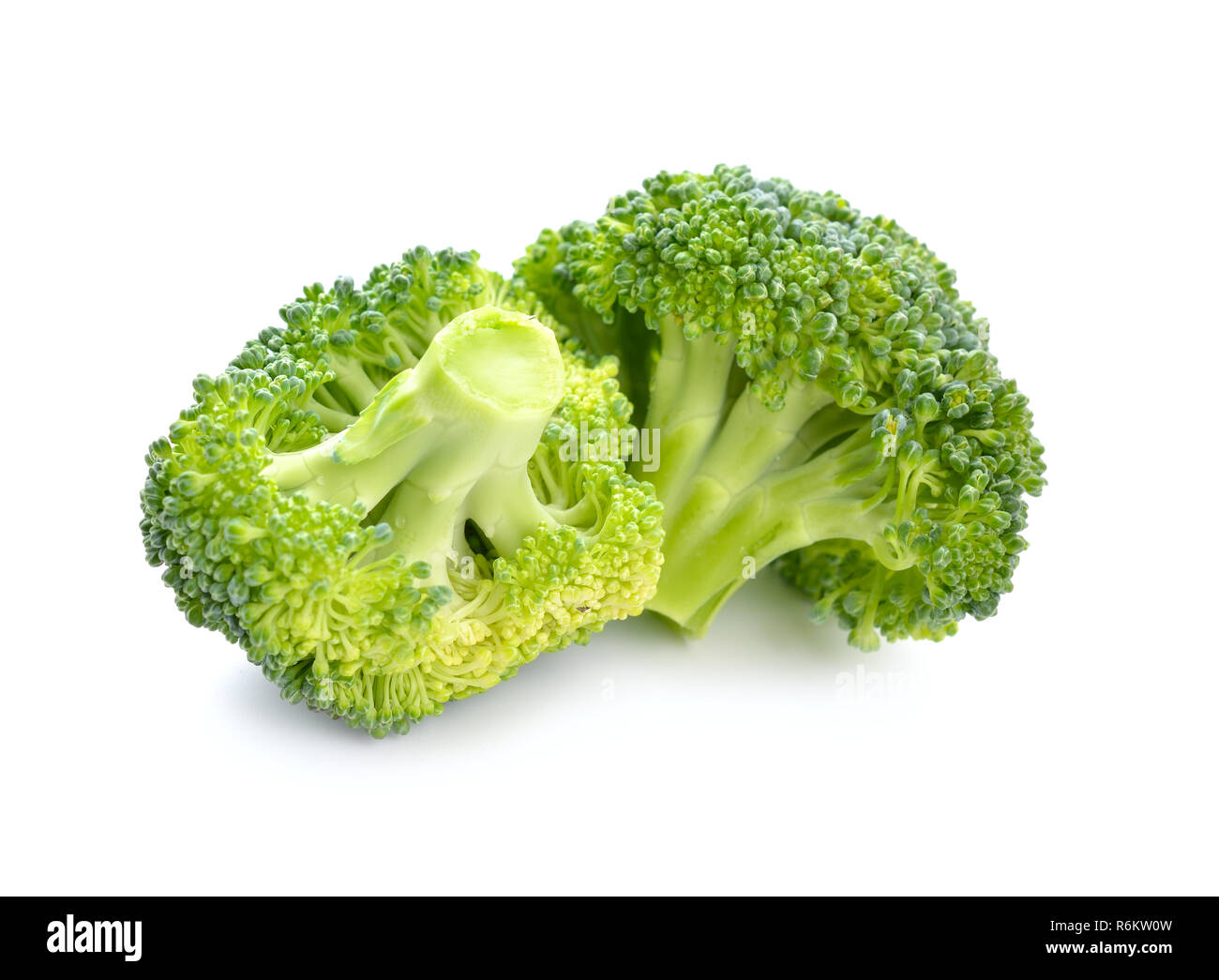 Two pieces of broccoli isolated on white background Stock Photo - Alamy