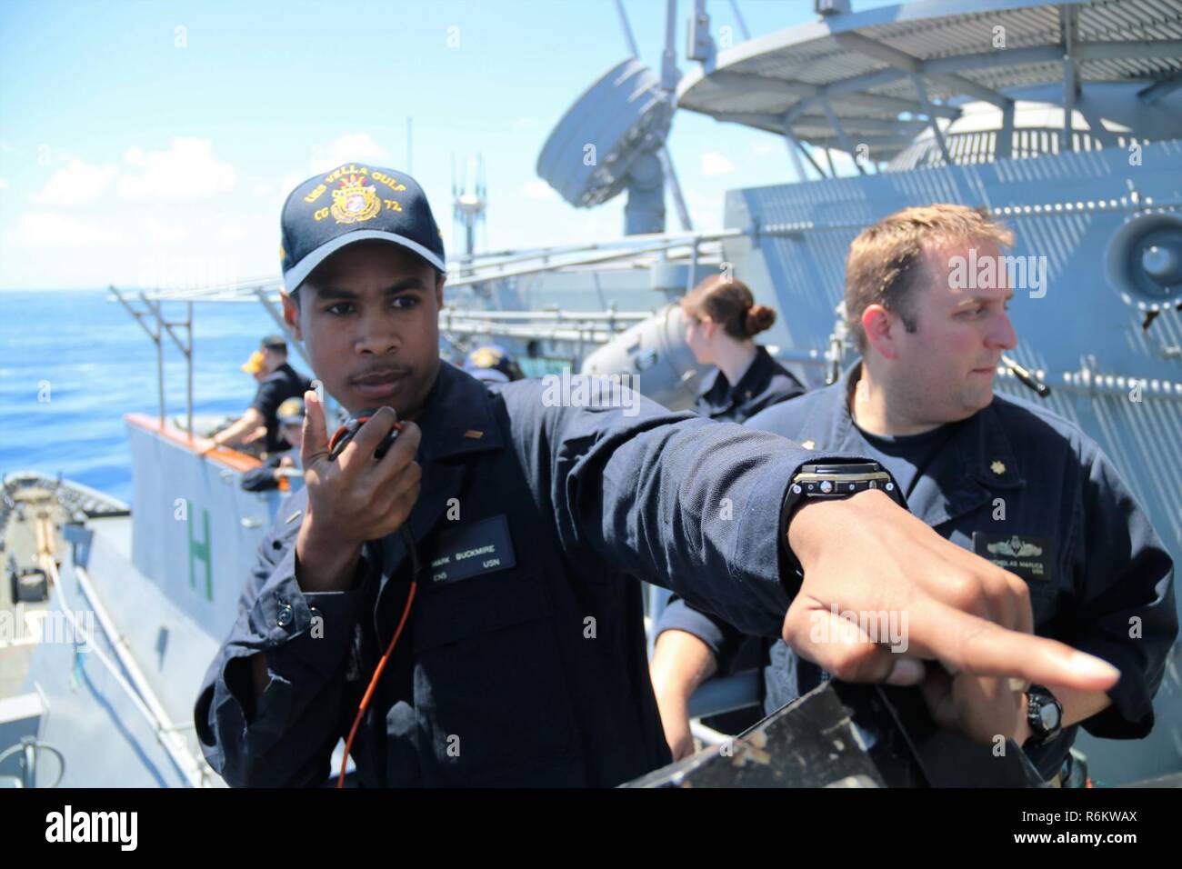 ATLANTIC OCEAN (May 7, 2017) Ensign Mark Buckmire communicates with the ...