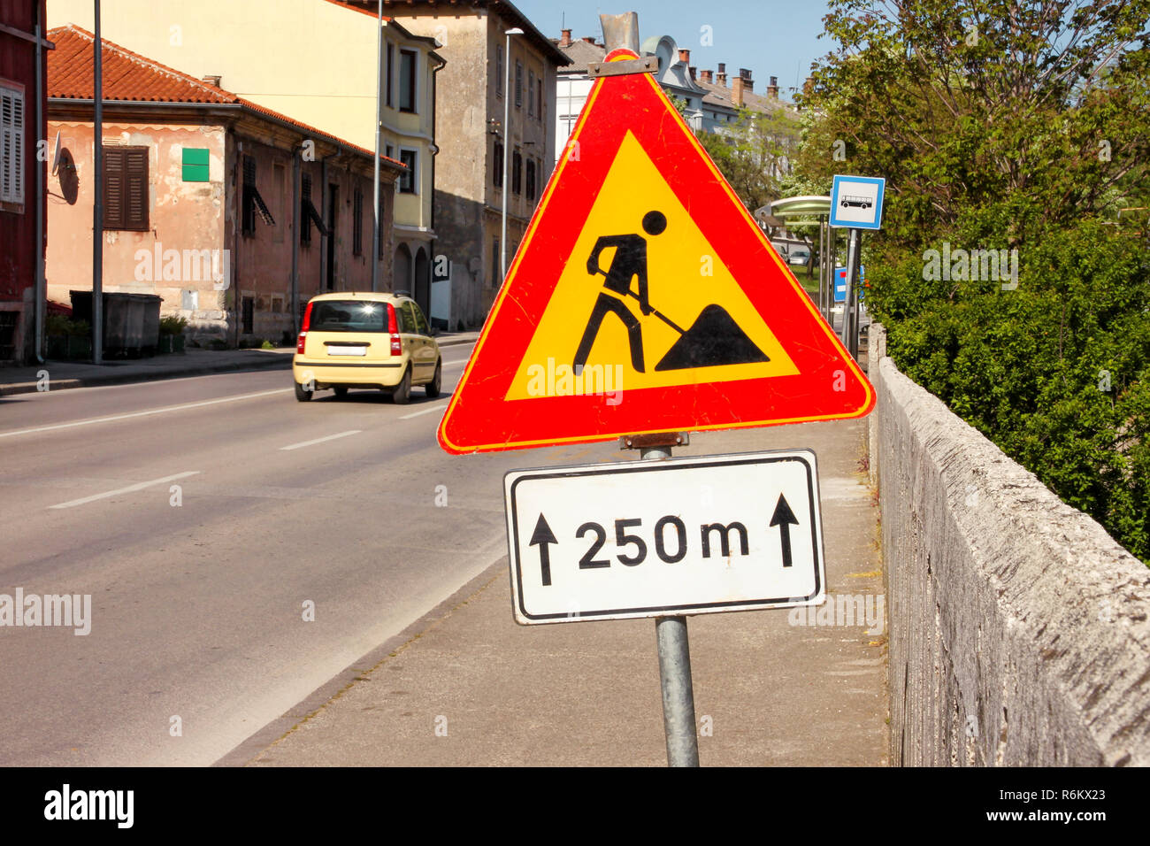 Road works sign for construction works in city street. Road under ...
