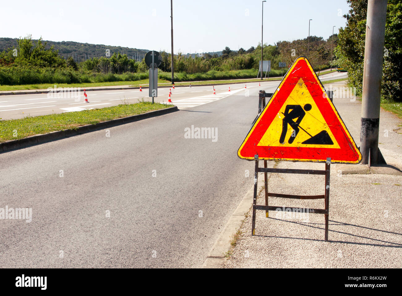Road works sign for construction works in city street. Road under ...
