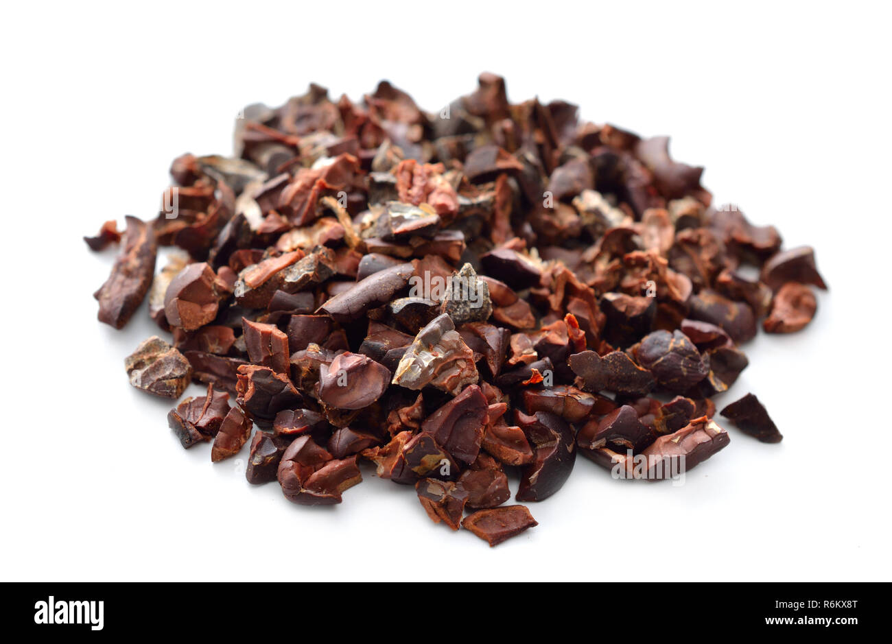 Cocoa nibs. Isolated on white background Stock Photo - Alamy