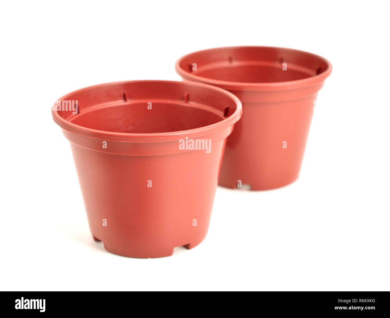 Empty flower pots. Isolated on white background Stock Photo - Alamy