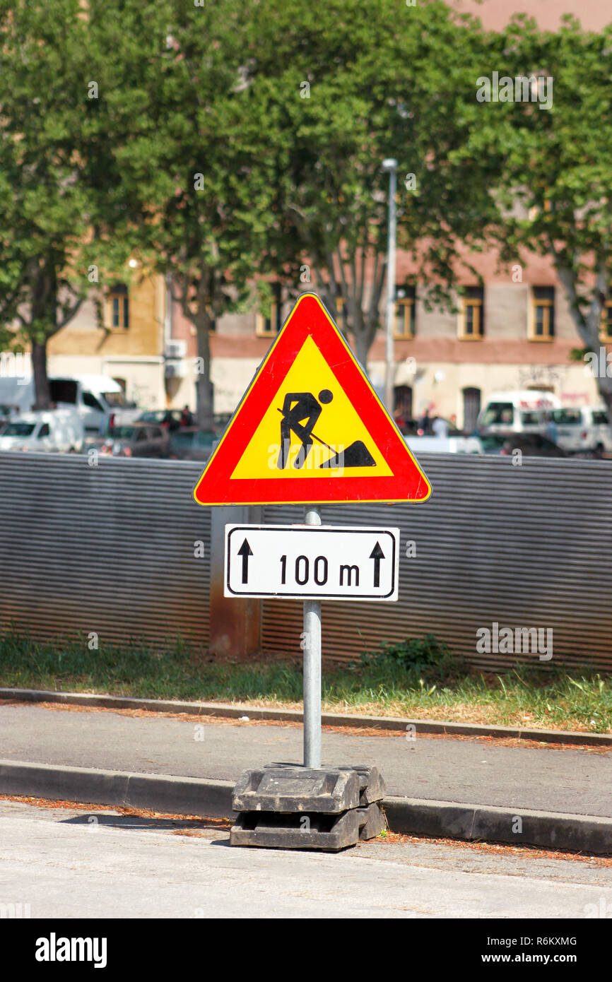 Road works sign for construction works in city street. Road under ...