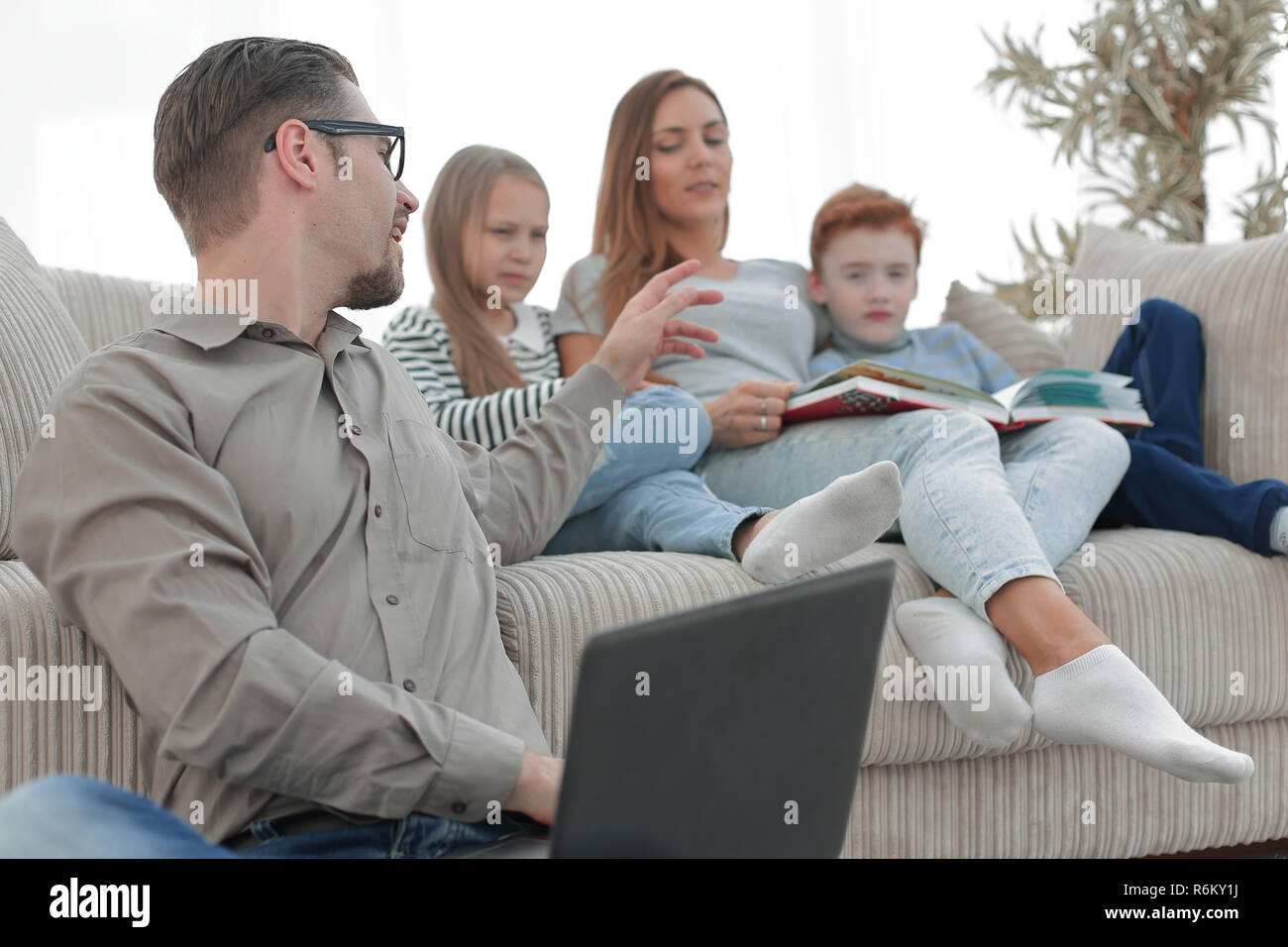 happy family spends their free time in their living room Stock Photo ...