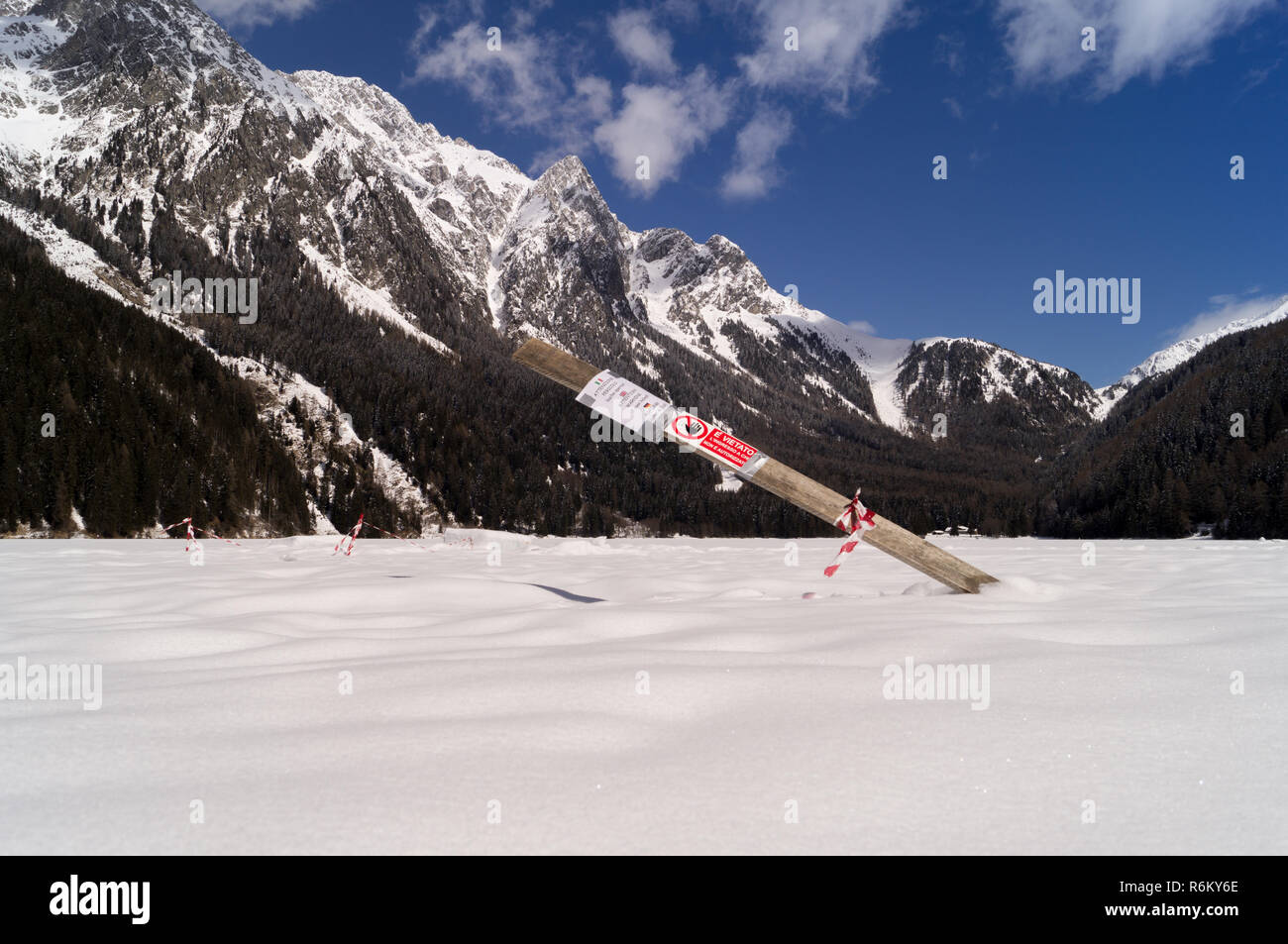 Warning sign on the frozen lake Stock Photo - Alamy