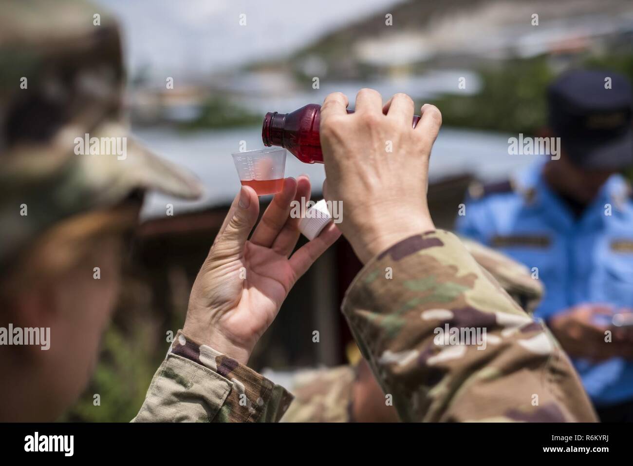 U.S. Army Lt. Col. Rhonda Dyer, Joint Task Force - Bravo, measures out ...