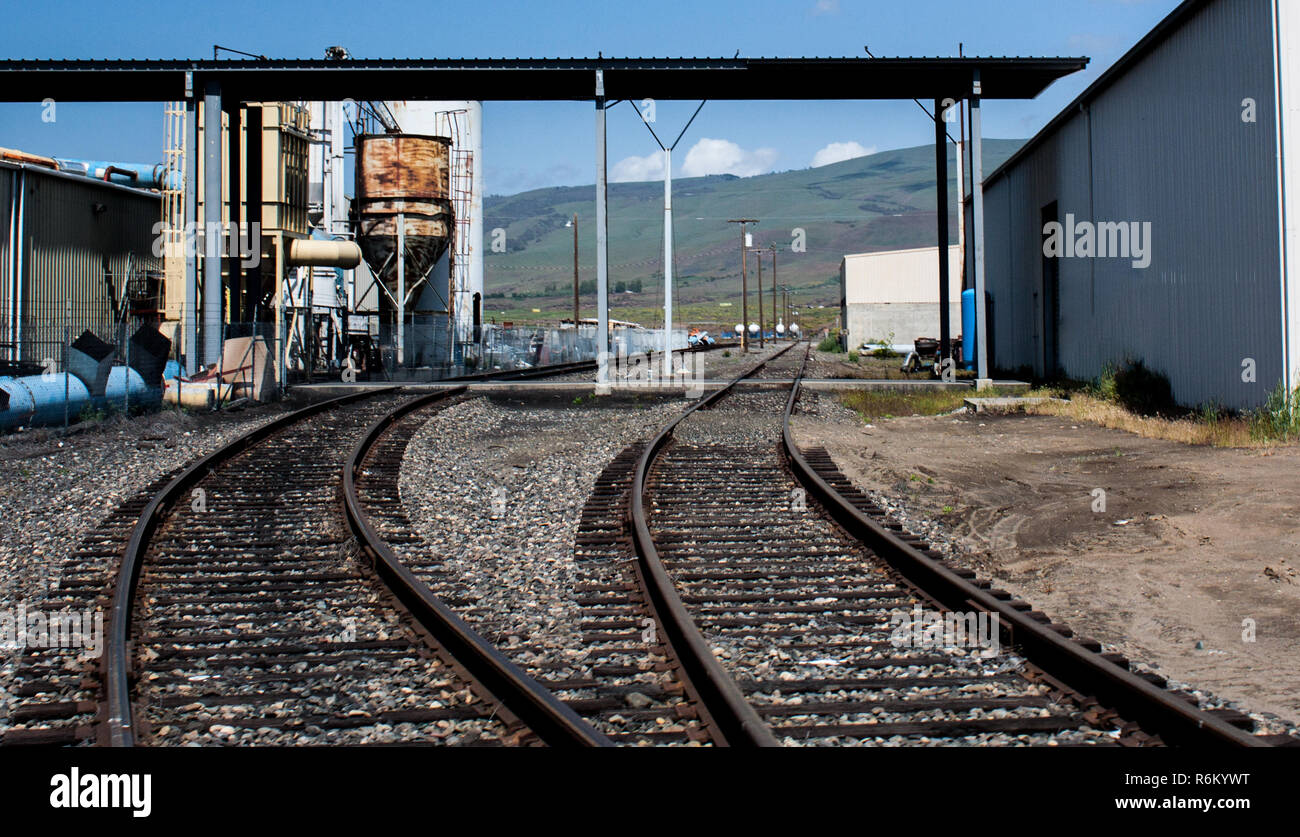 2 railroad tracks leading in to a loading unloading facility Stock ...