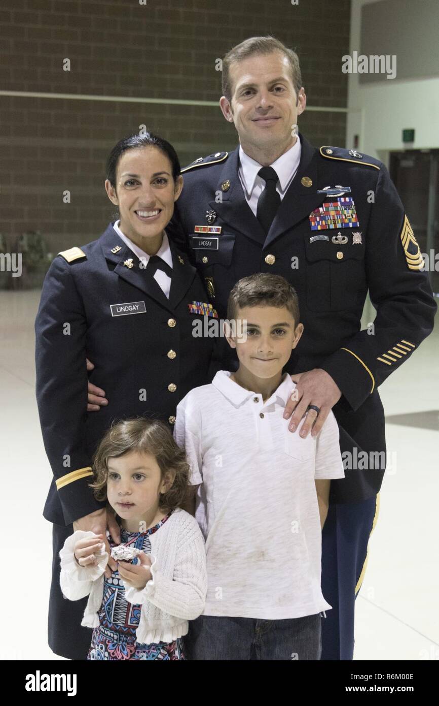 2nd Lt. Marisa Lindsay poses with her husband, Master Sgt. Michael ...