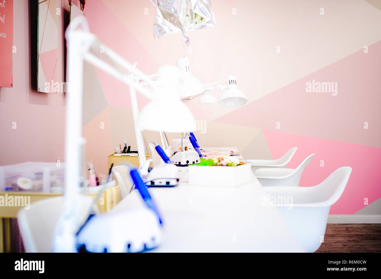 Workplace in a bright manicure salon. Working table of the master of ...
