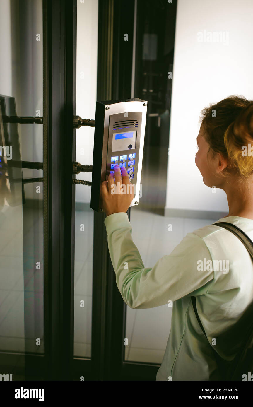 Female press intercom open door hi-res stock photography and images - Alamy