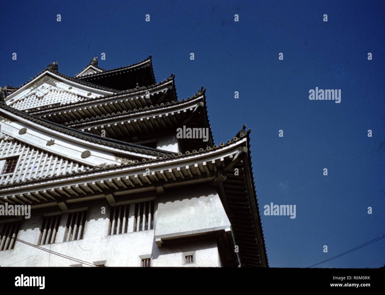 Architectural detail view of side of Osaka Castle showing rooftop ...