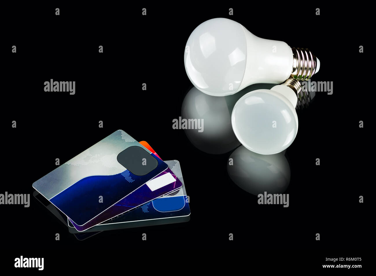 white innovation energy-saving LED bulb and credit cards Stock Photo ...
