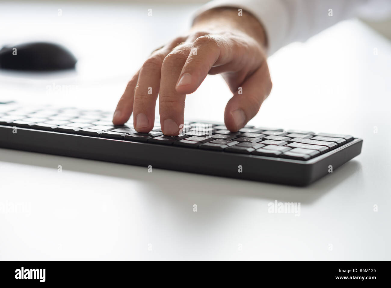 Closeup of male student using black computer keyboard typing Stock ...