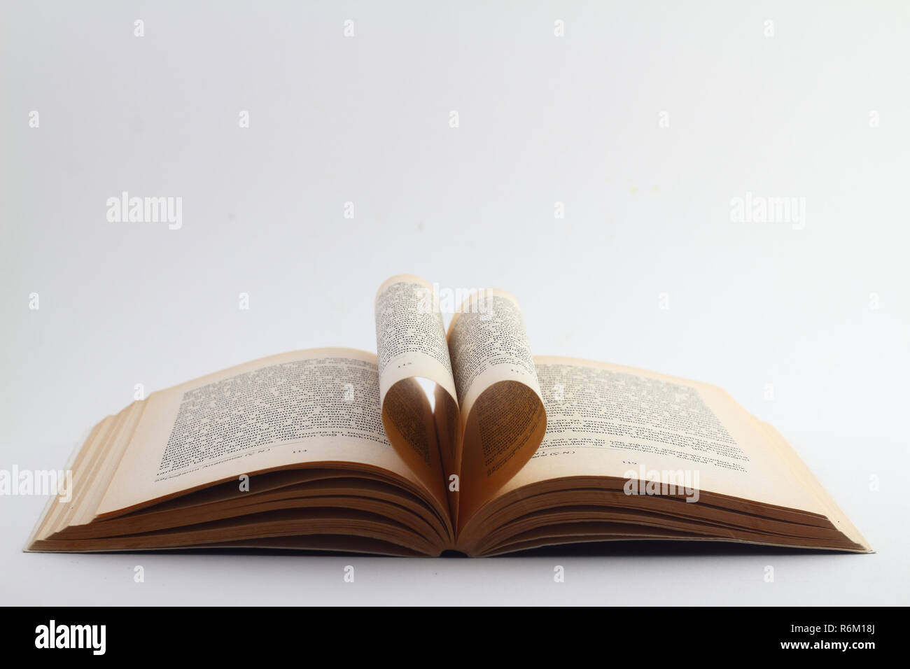 open book lying on a white background Stock Photo - Alamy