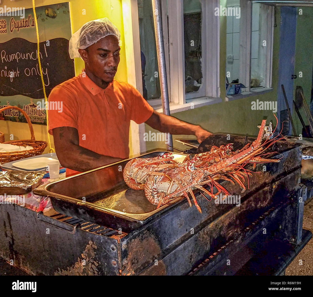 Huge lobsters on the grill during Oistins weekend fish fry. Barbados ...