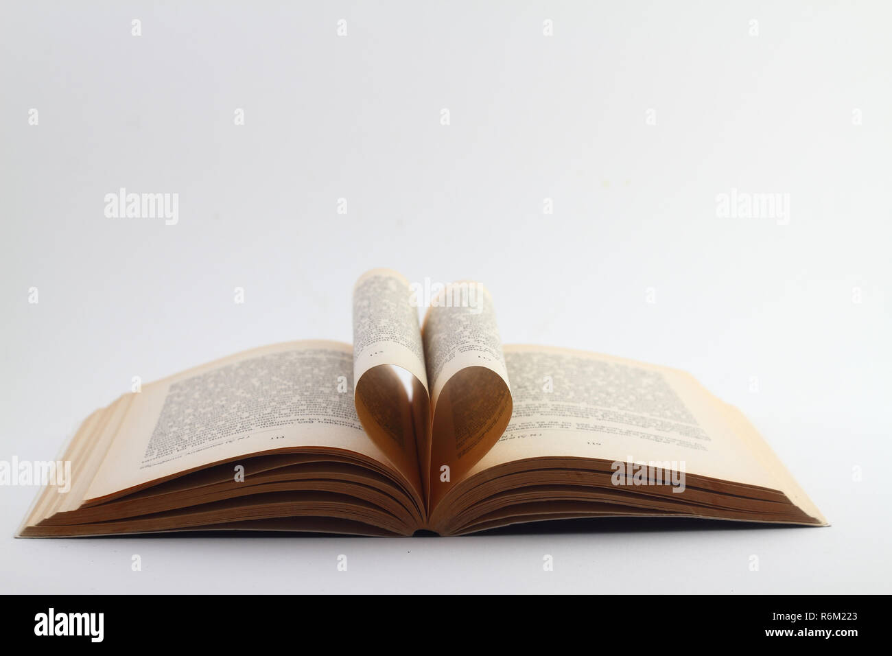open book lying on a white background Stock Photo - Alamy