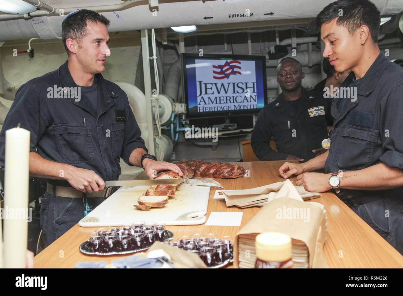 MEDITERRANEAN SEA (May 26, 2017) Lt. Benjamin Goldenberg, left, serves ...