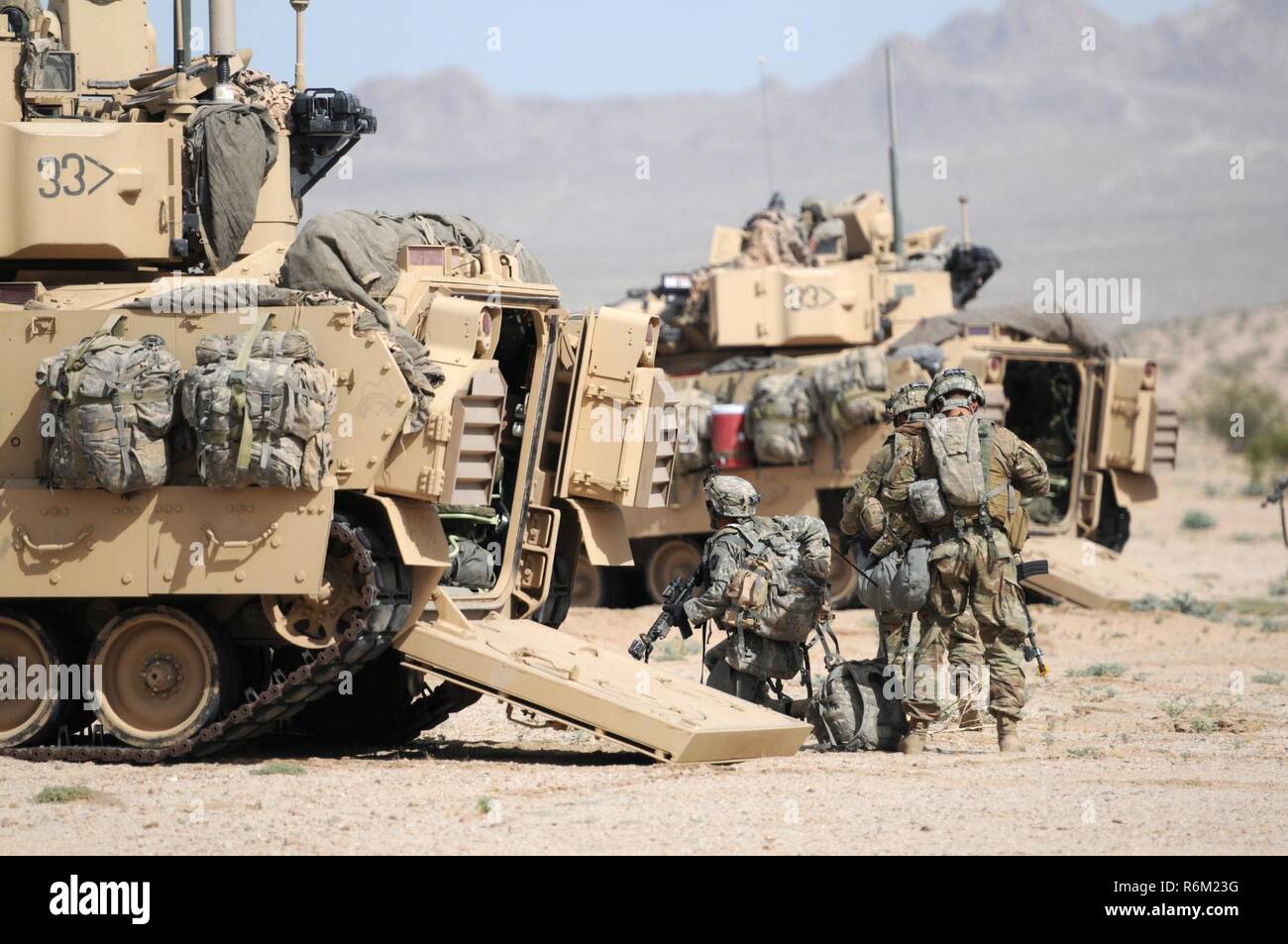 Soldiers of the 155th Armored Brigade Combat Team dismount from a ...