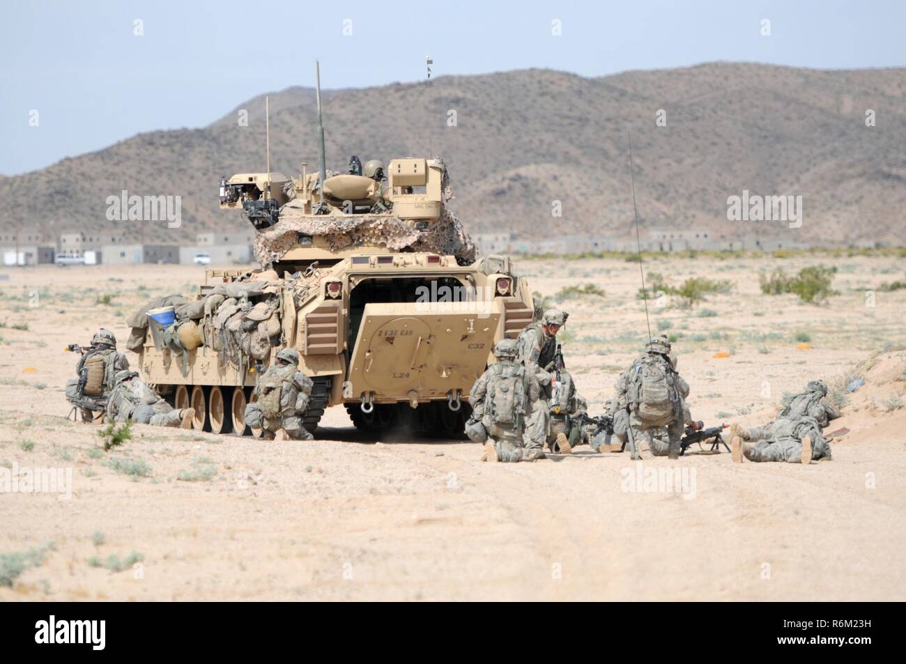 Soldiers of the 155th Armored Brigade Combat Team dismount from a ...
