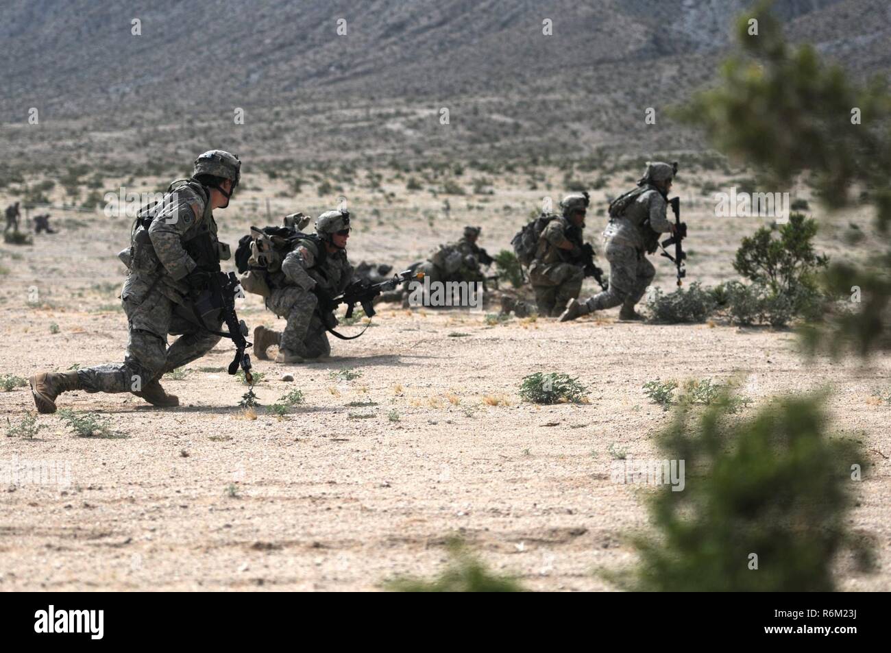 Soldiers of the 155th Armored Brigade Combat Team move forward to ...