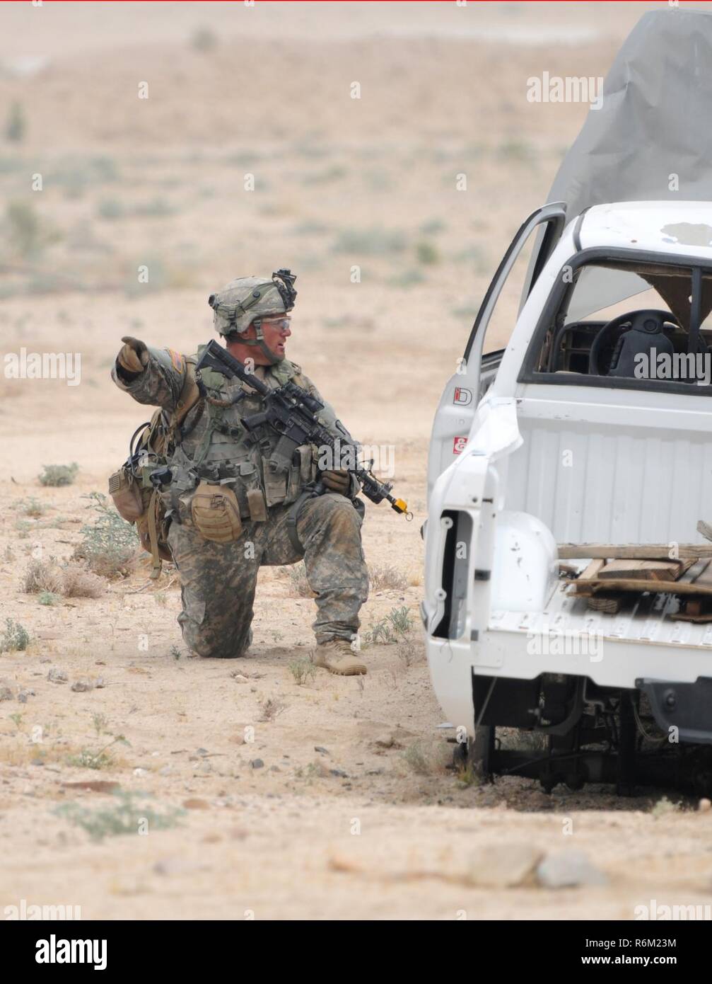 A Soldier of the 155th Armored Brigade Combat Team providing directions ...