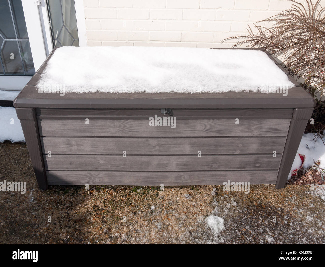snow on top of plastic container outside in garden closed locked Stock ...
