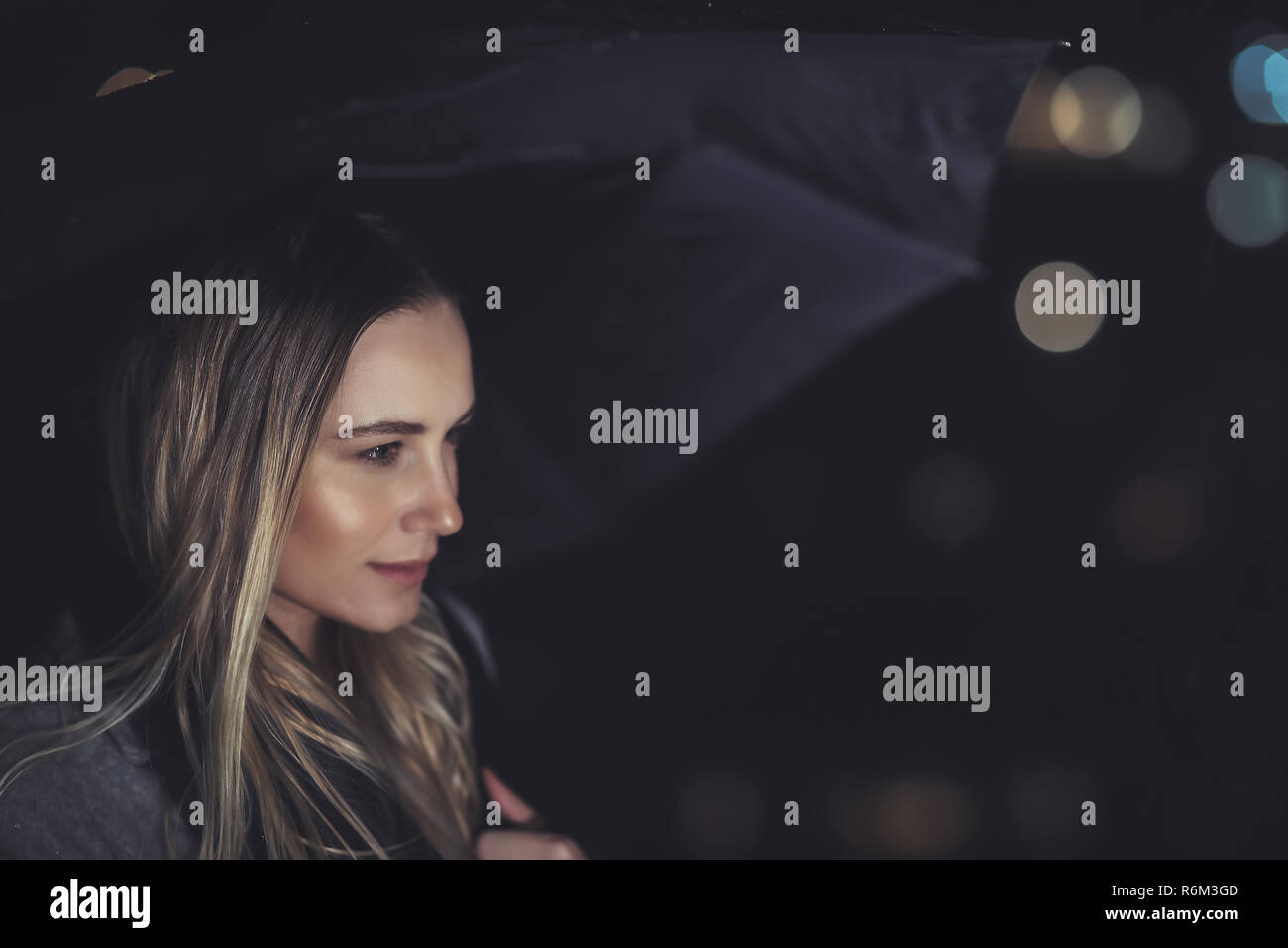 Beautiful woman at rainy night Stock Photo - Alamy