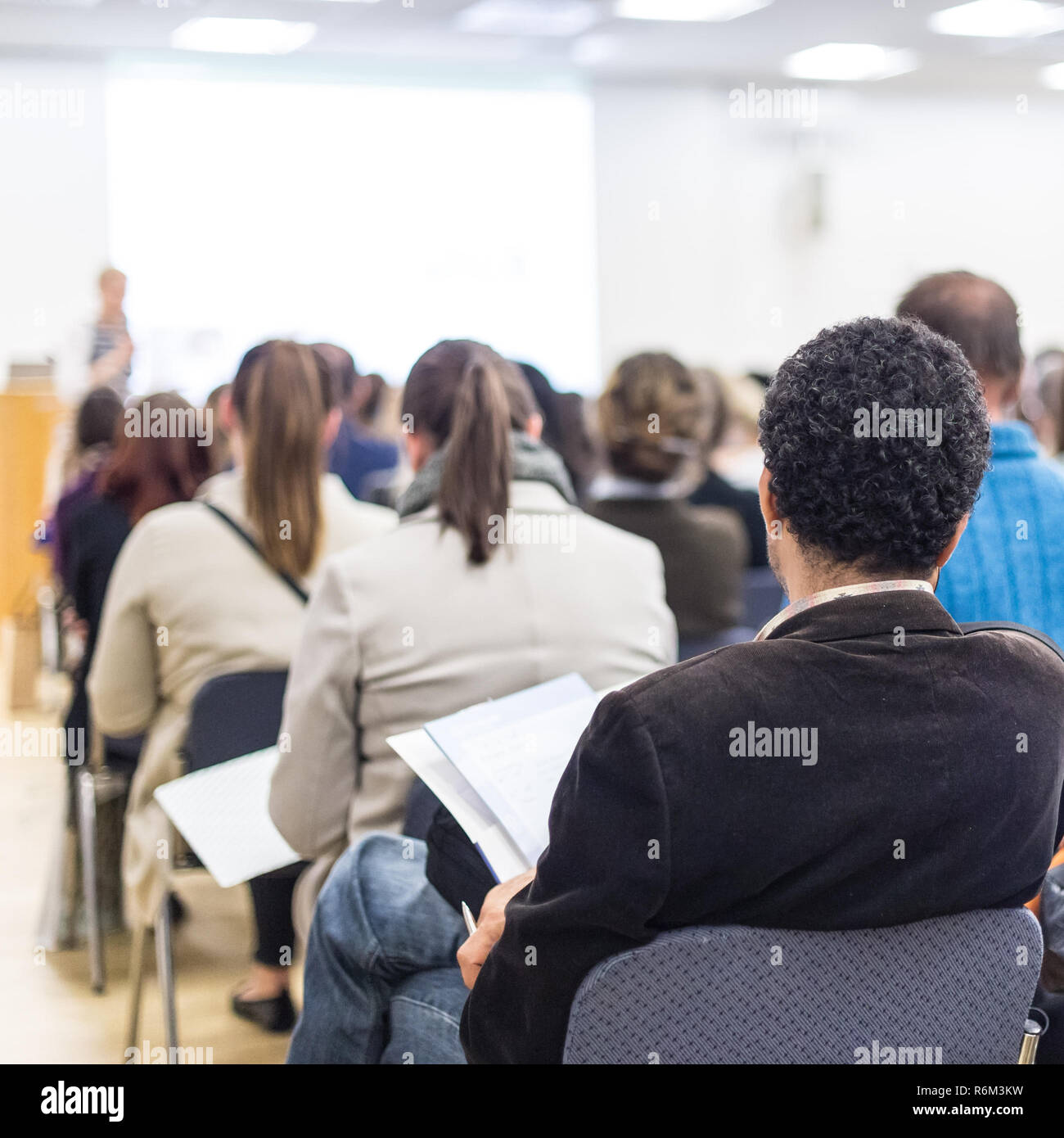 Woman giving presentation on business conference Stock Photo - Alamy