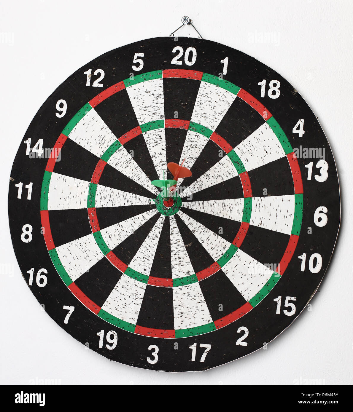 side view.Arrow dart hitting the center of the target dart Board Stock ...