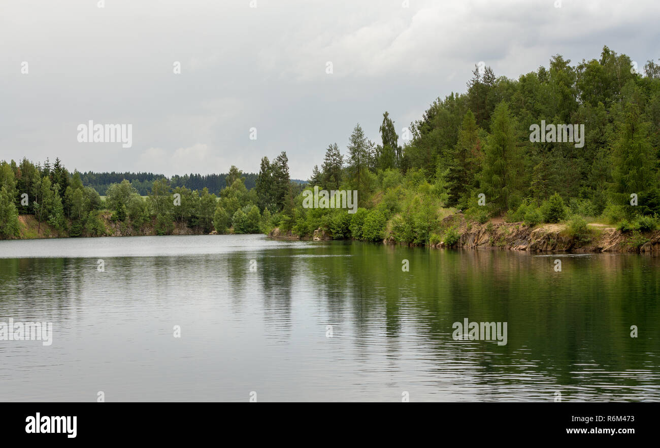 abandoned flooded quarry, Czech republic Stock Photo - Alamy