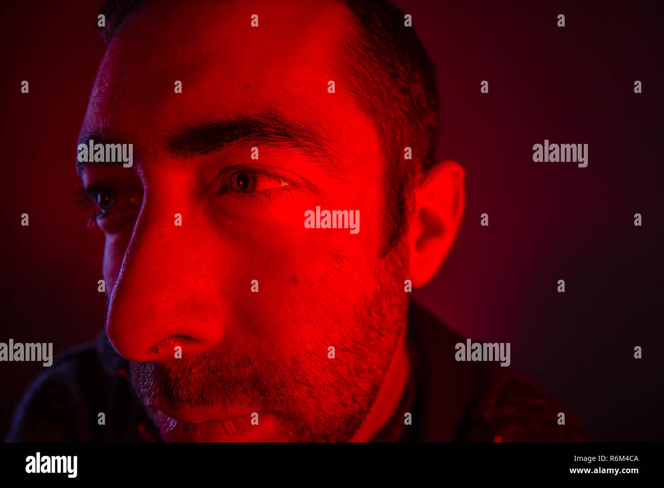 Man with serious facial expression look a side Stock Photo - Alamy