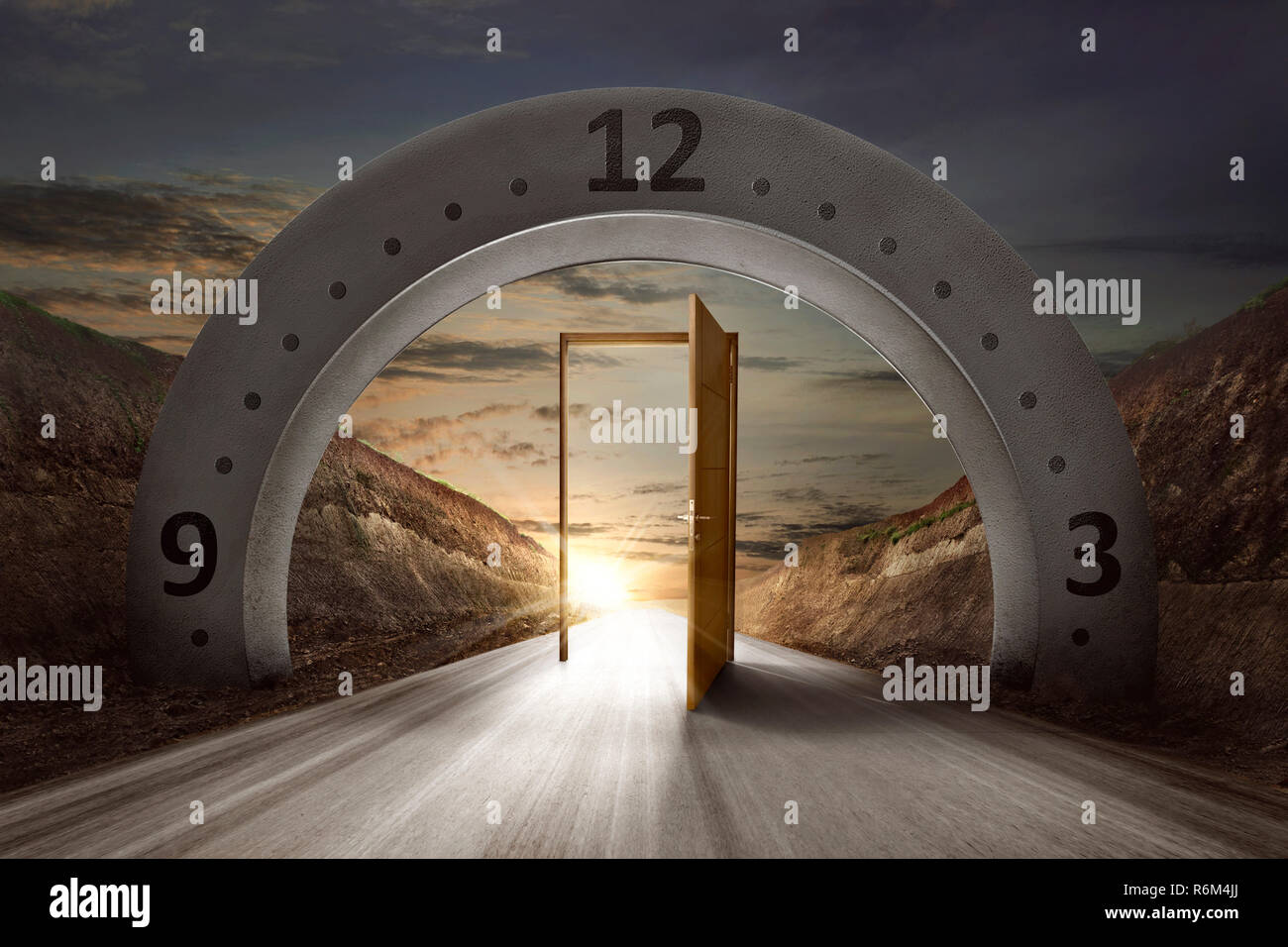 Gateway arch with clock face and open door Stock Photo - Alamy