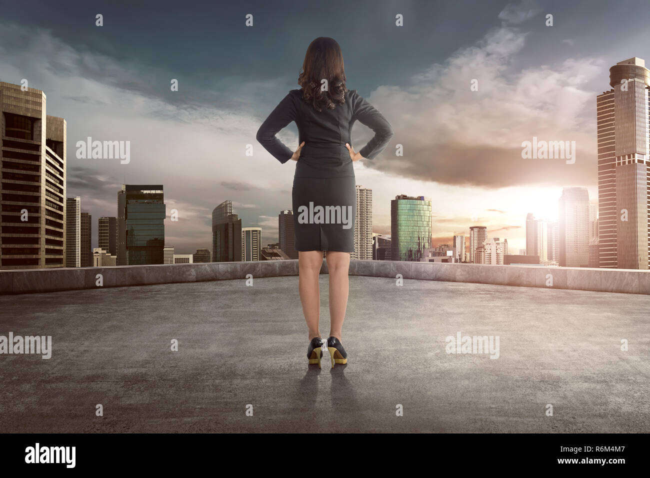 Back view of asian business woman looking at sunset view Stock Photo ...