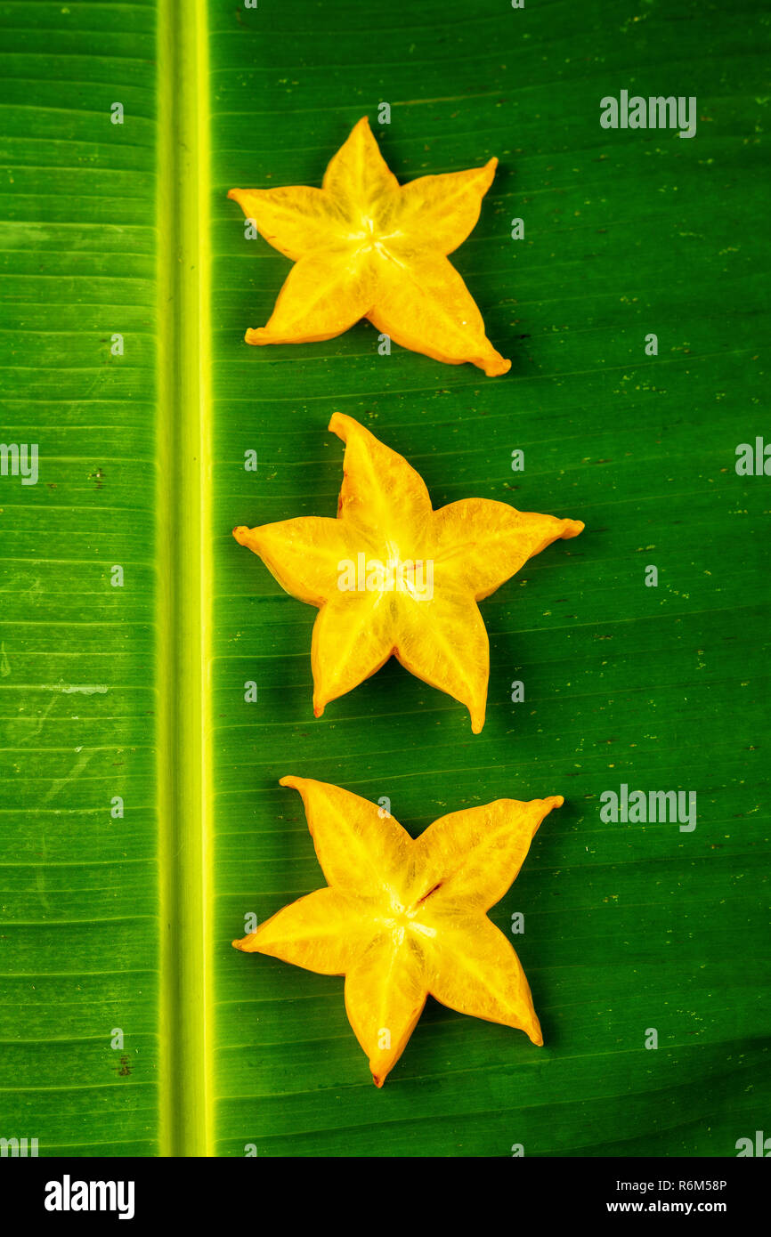 Three Slices of ripe yellow star fruit carambola or star apple ...
