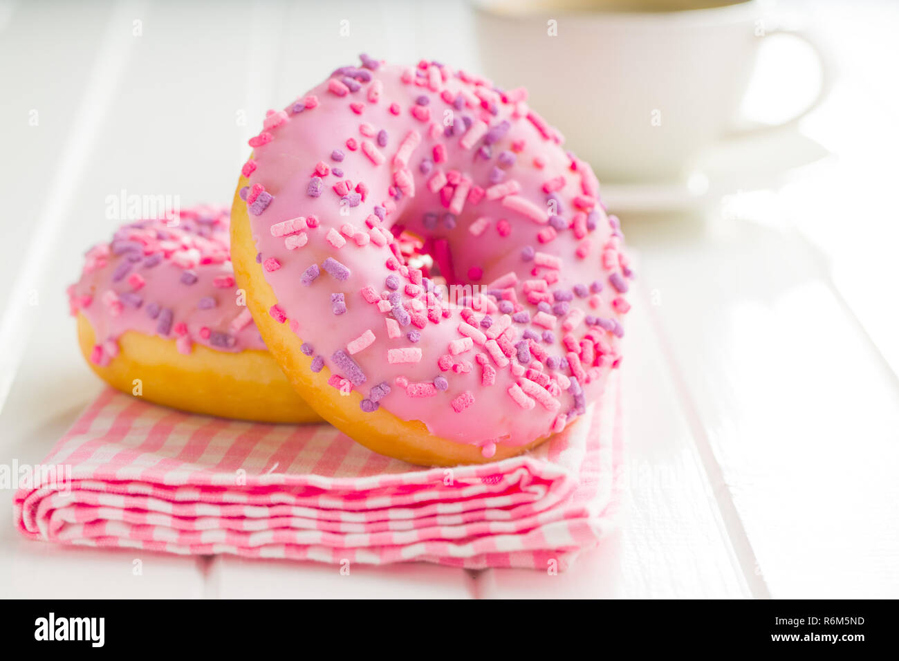 Two pink donuts Stock Photo - Alamy