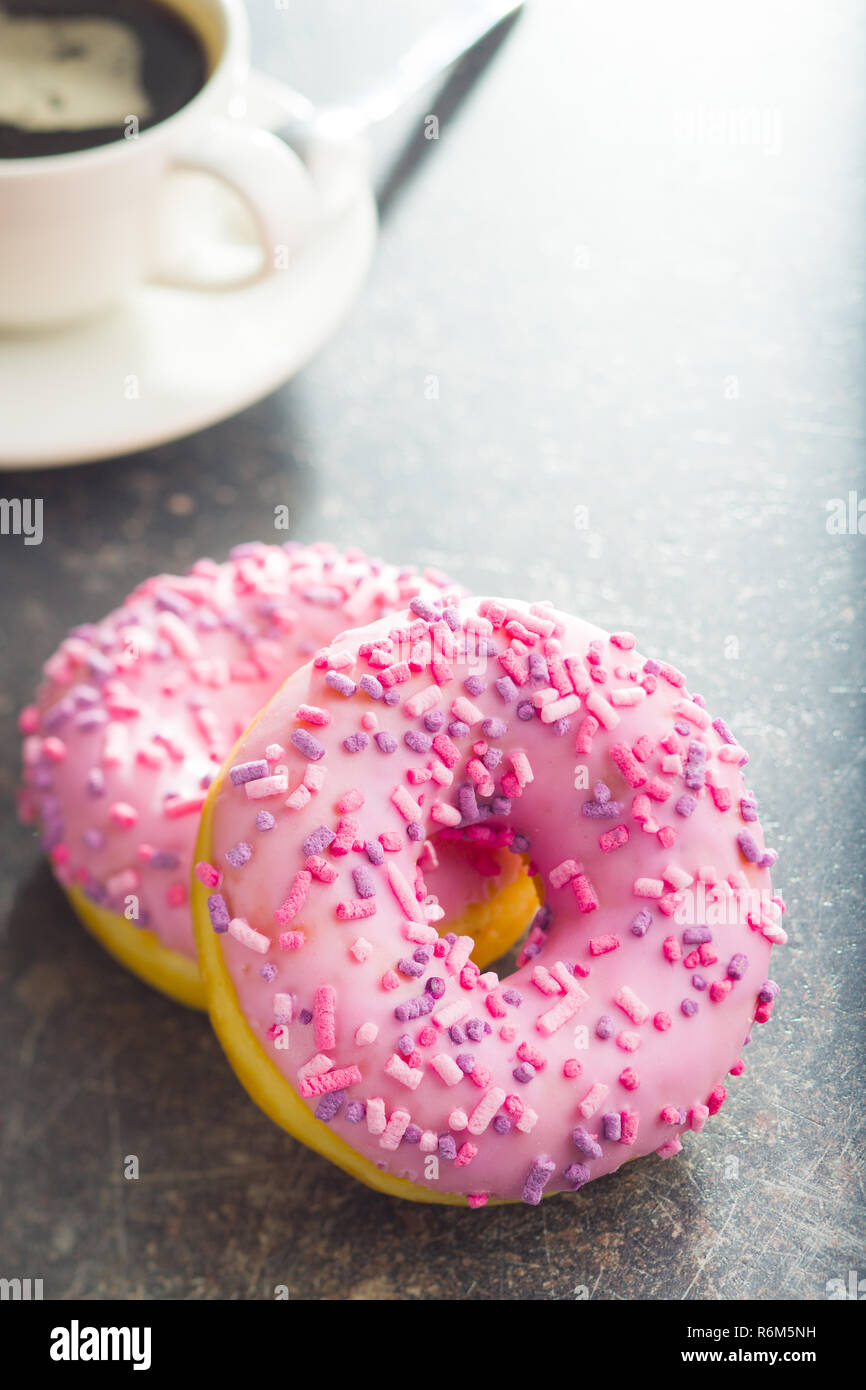 Two pink donuts Stock Photo - Alamy