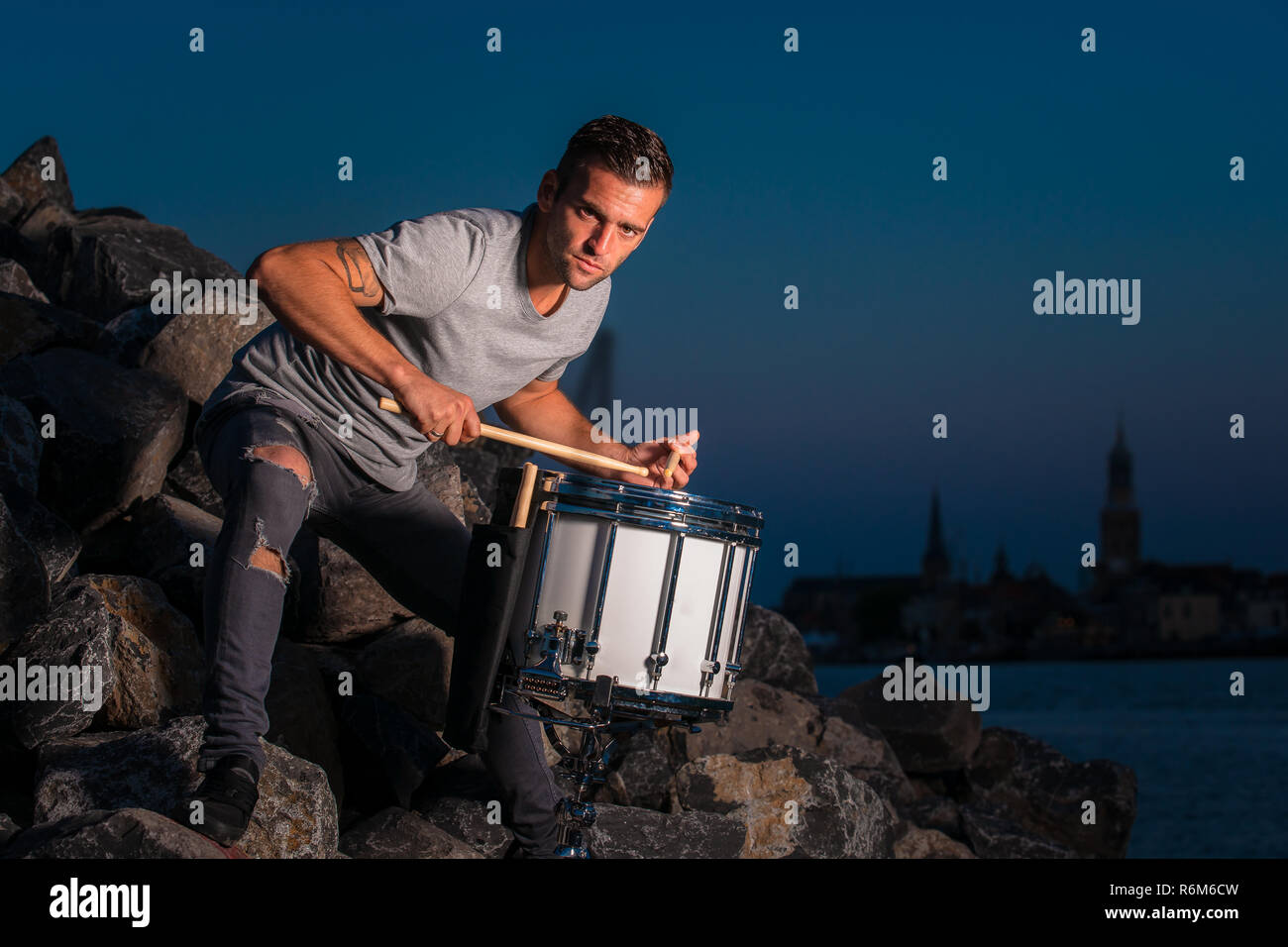 Various details of a performing music artist with percussion ...