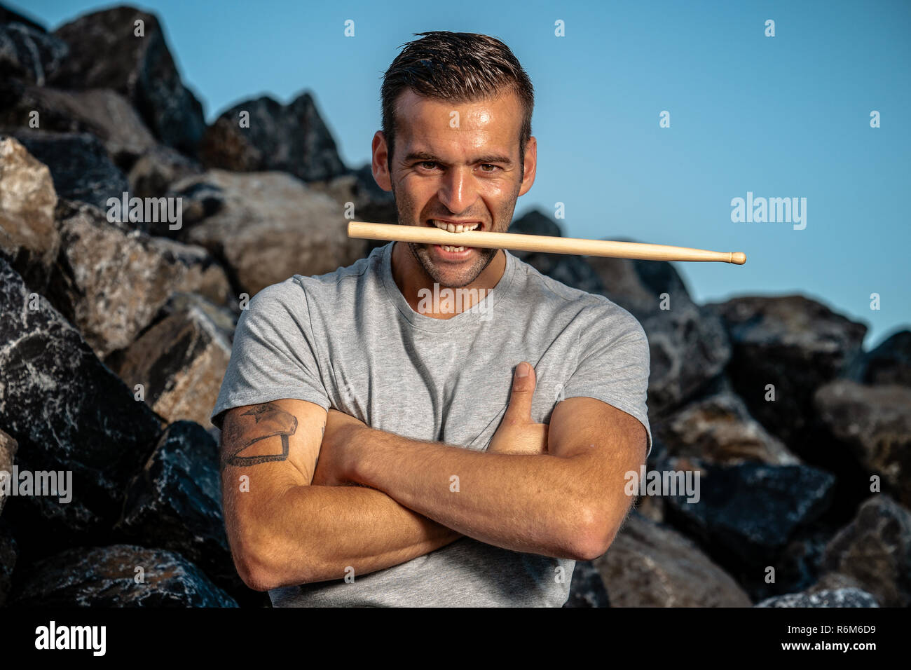 Various details of a performing music artist with percussion ...