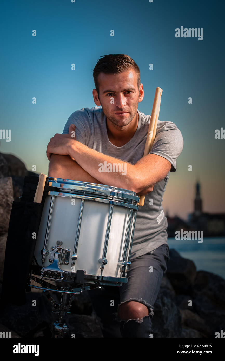 Various details of a performing music artist with percussion ...