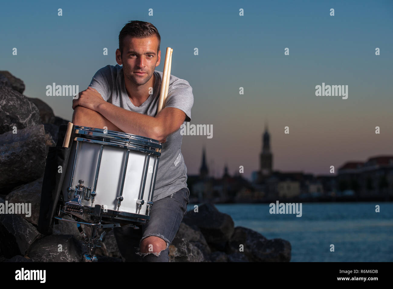 Various details of a performing music artist with percussion ...