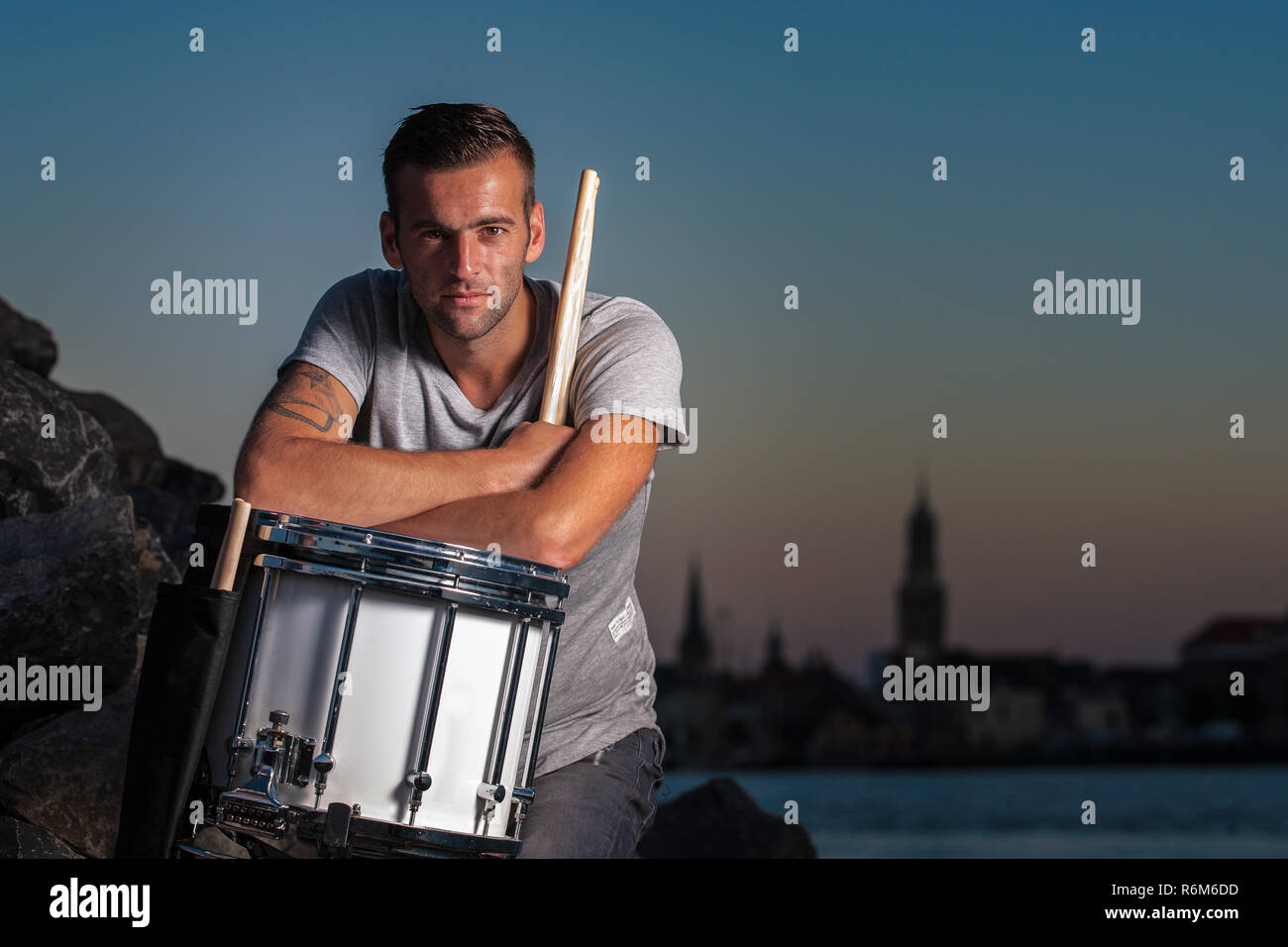 Various details of a performing music artist with percussion ...