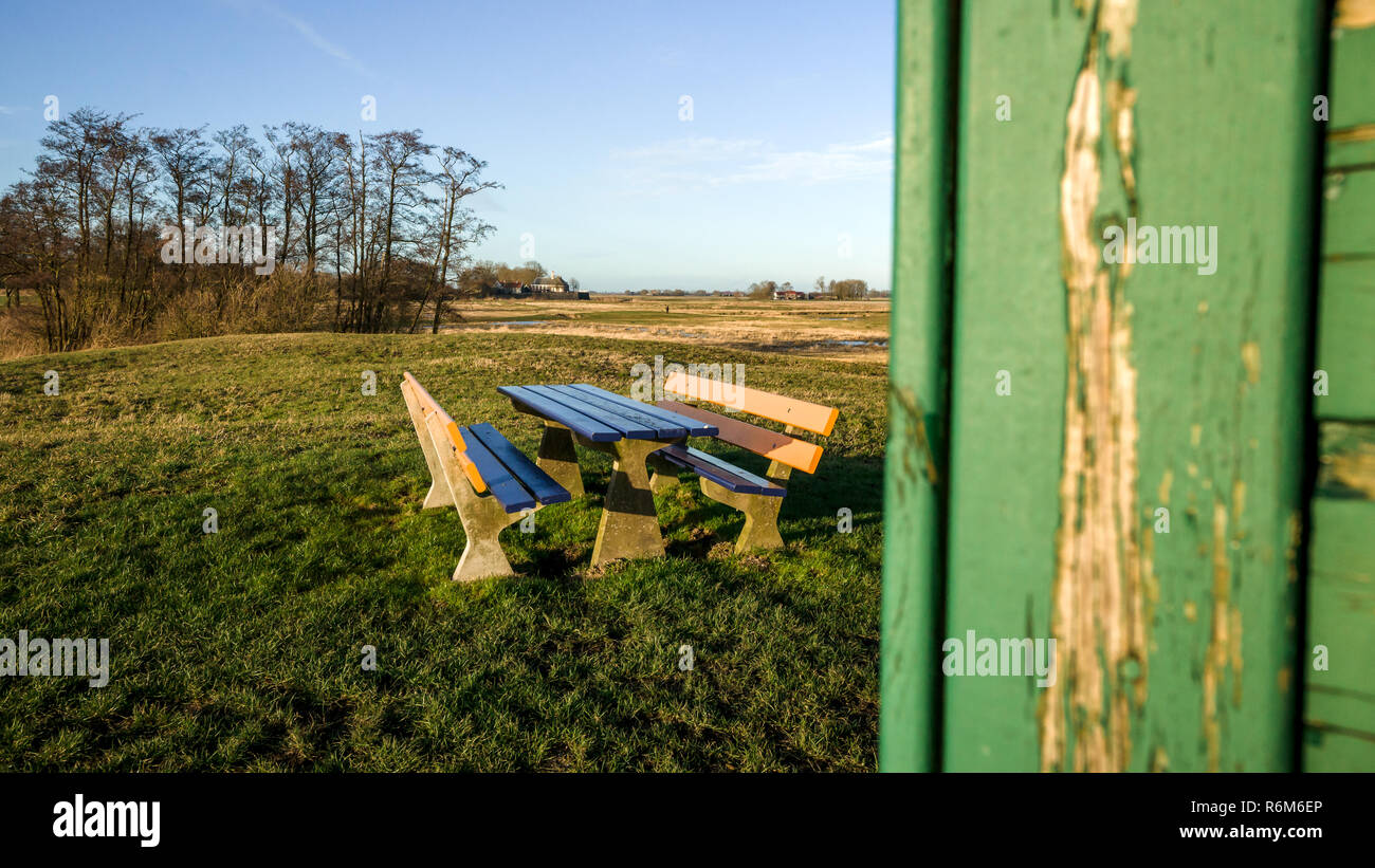 Traditional vintage wooden cottage in typical dutch polder landscape on ...
