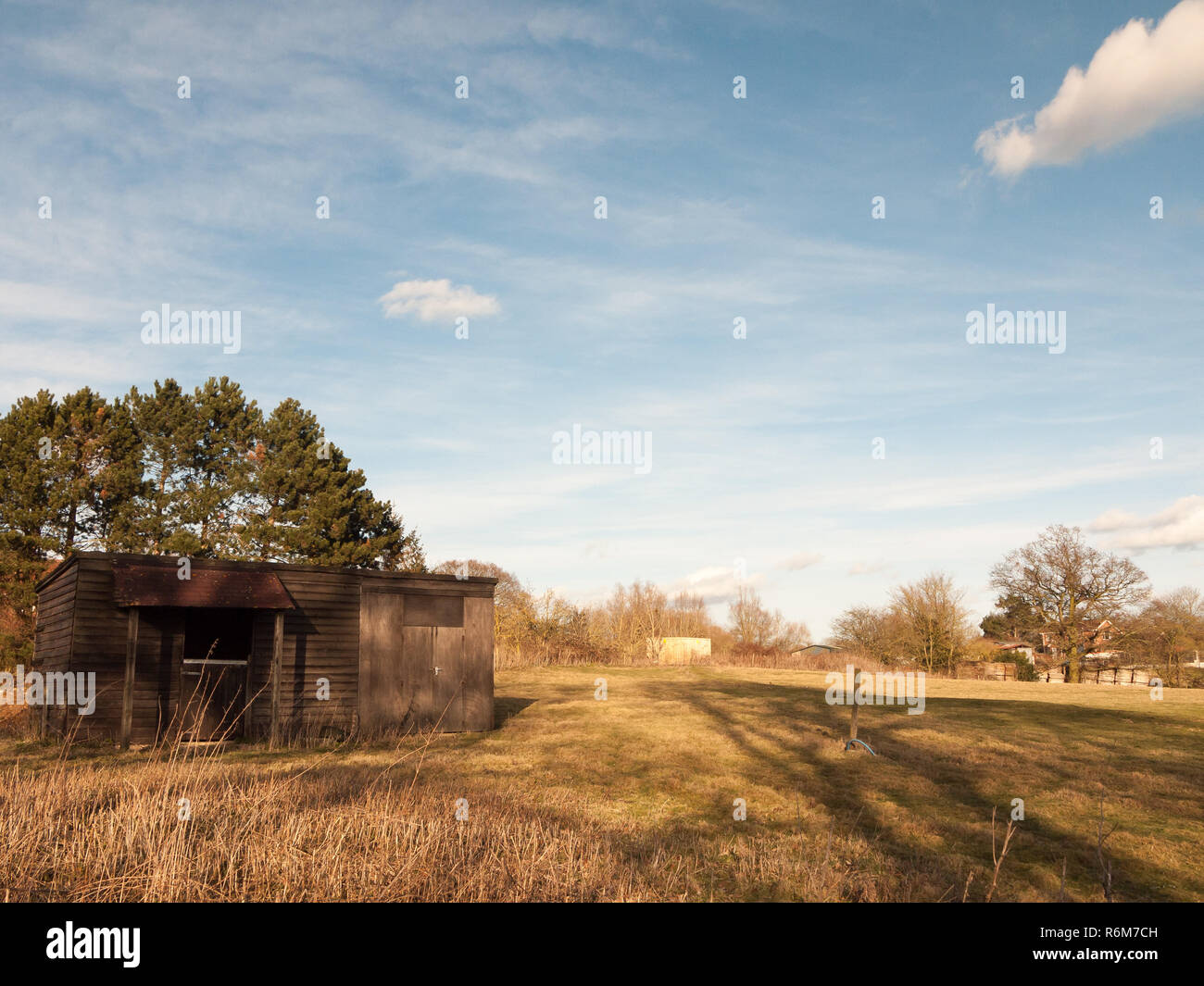 farm field outside with shed nature agriculture empty Stock Photo - Alamy